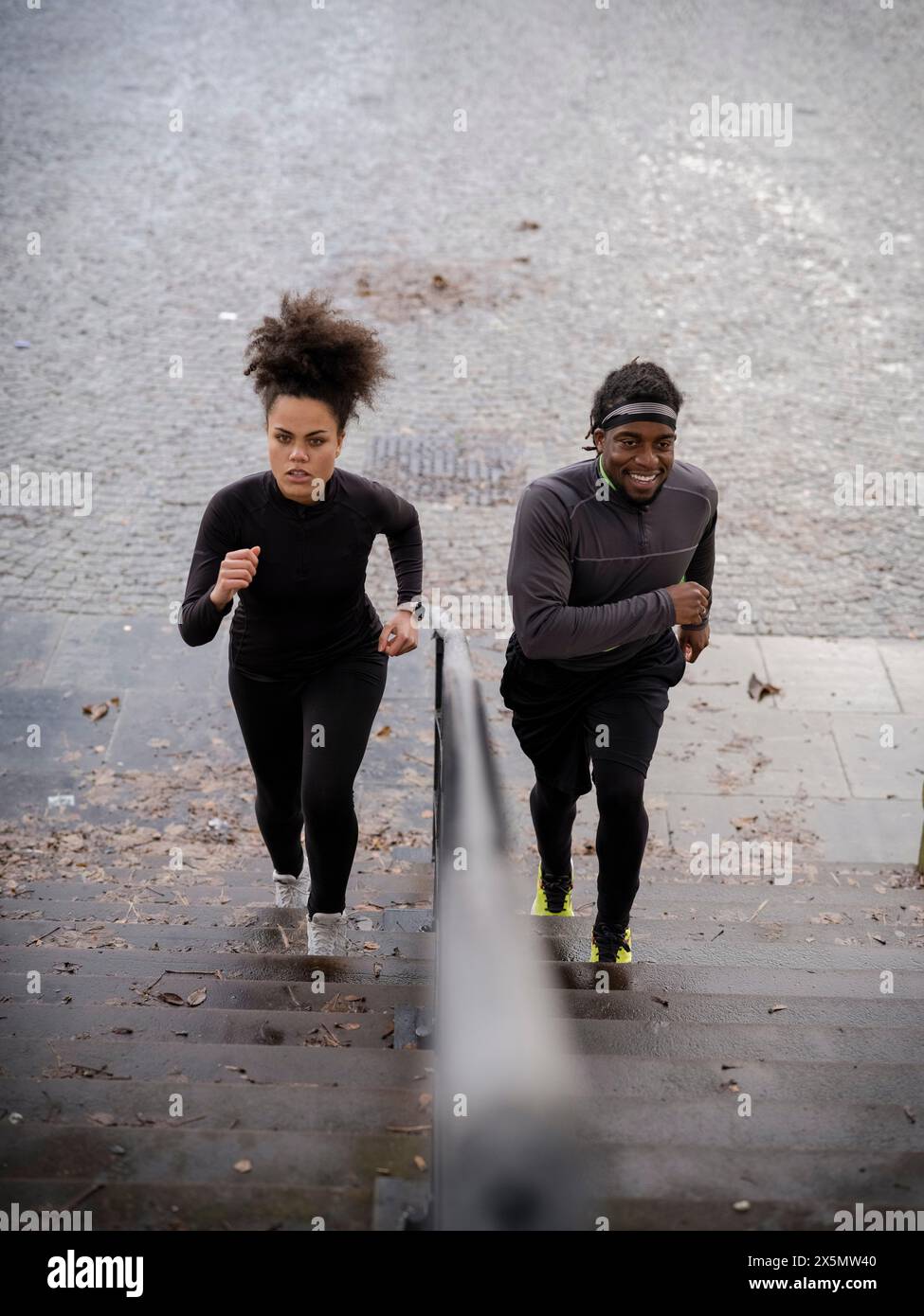 Woman up steps hi-res stock photography and images - Alamy