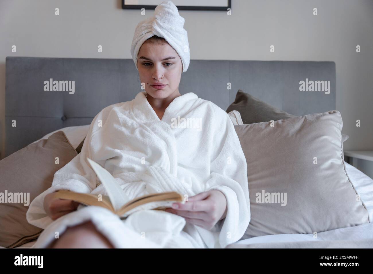 Wrapped bathrobe hi-res stock photography and images - Alamy