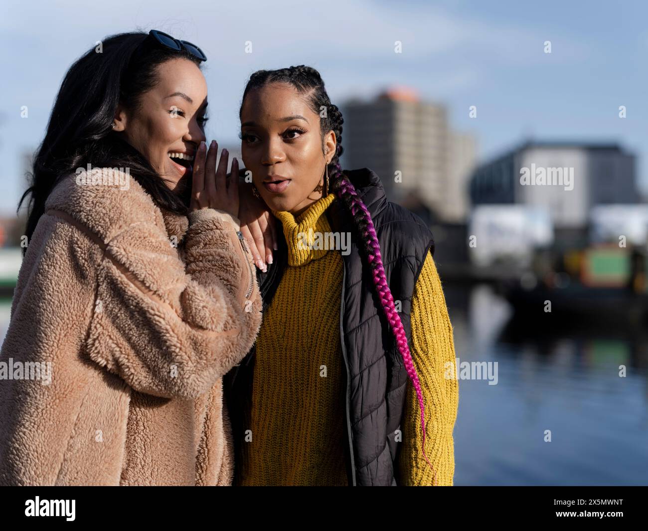 Two young women in urban setting Stock Photo - Alamy