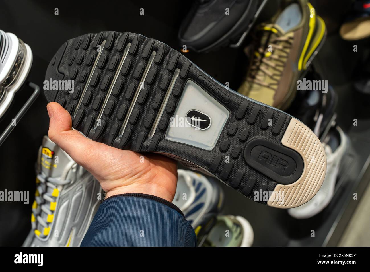 The sole of Nike Air sneakers close-up. Nike logo on the sole of the ...