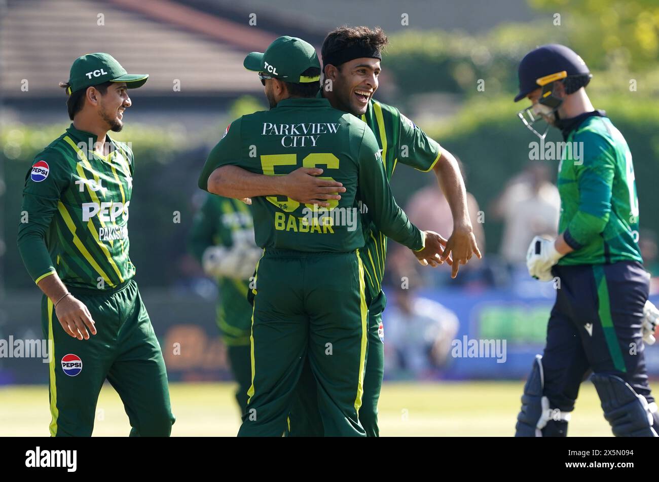 Pakistan's Abbas Afridi and Babar Azam celebrate the wicket of Ireland ...