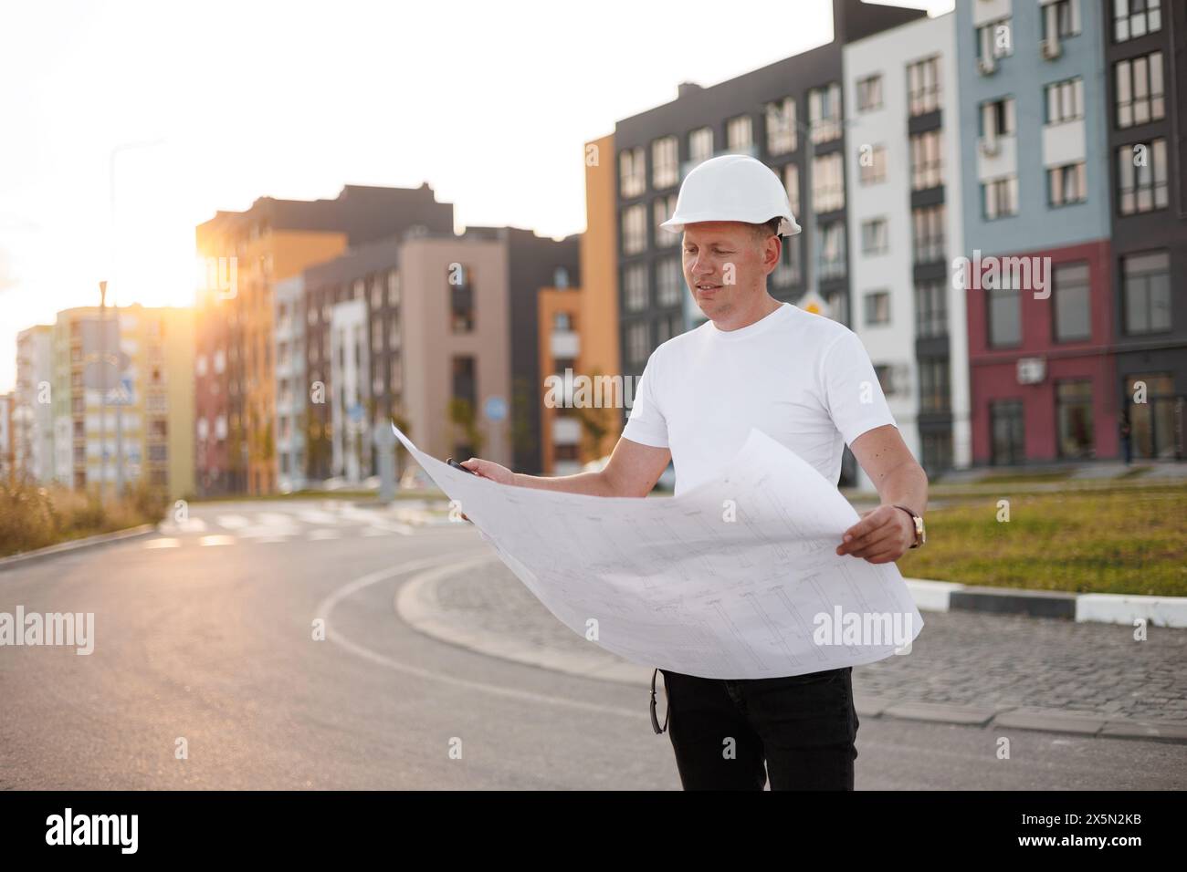 Successful engineer, architect, builder, businessman in hard hat, holds ...