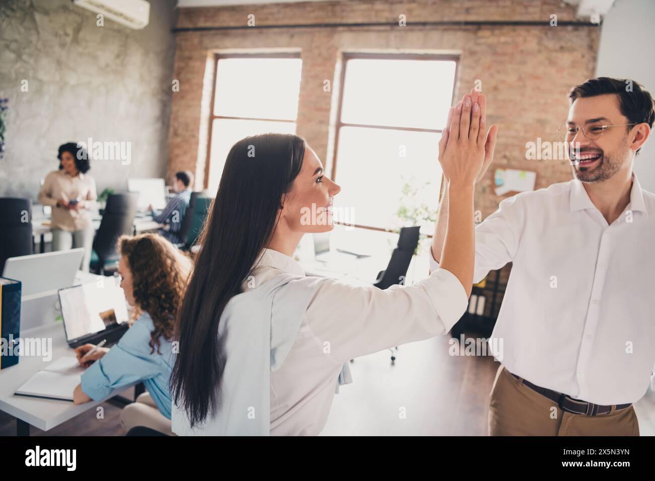 Photo of teamwork young people high five working together employees ...