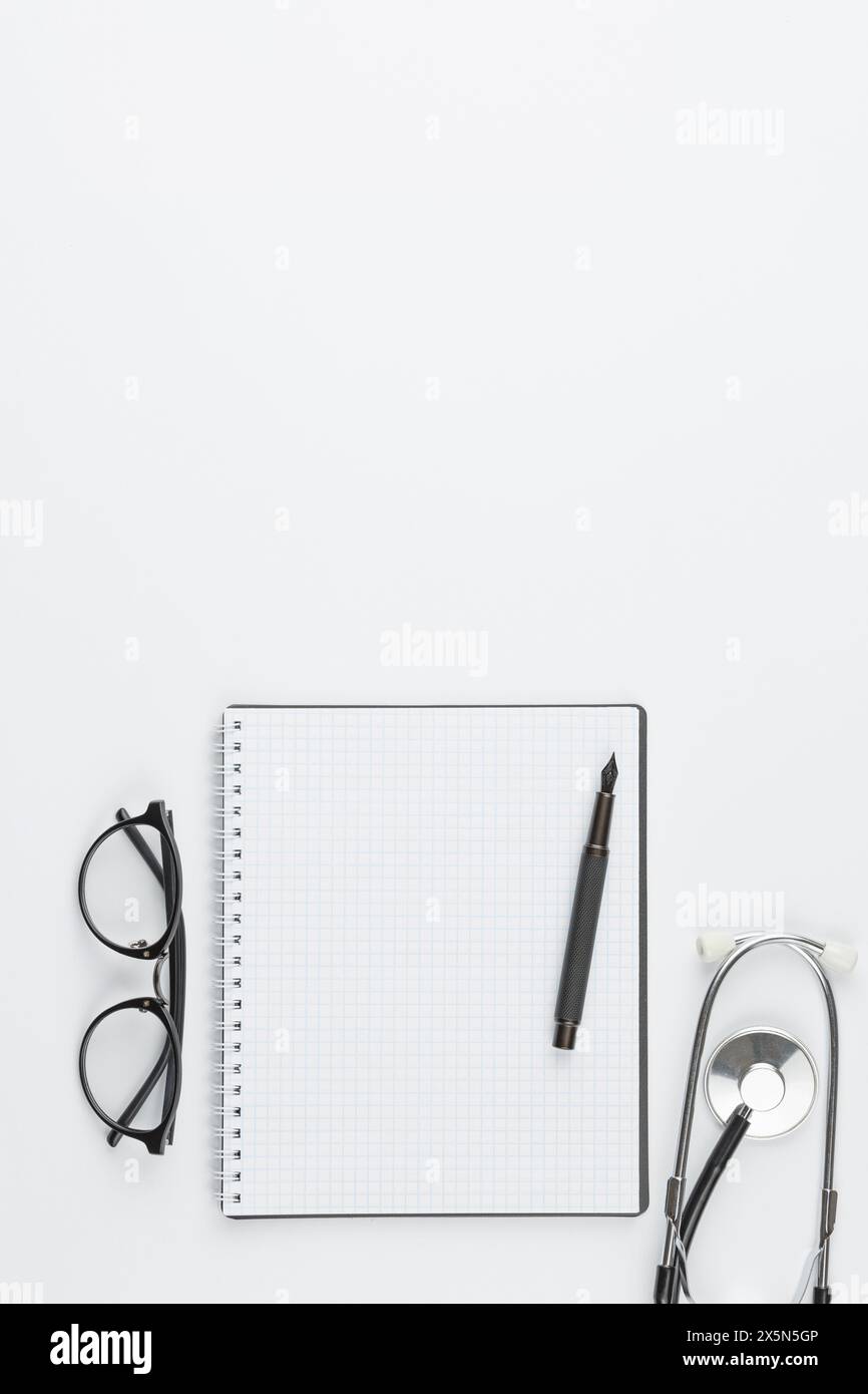 Doctor desk with stethoscope and stationery Stock Photo - Alamy