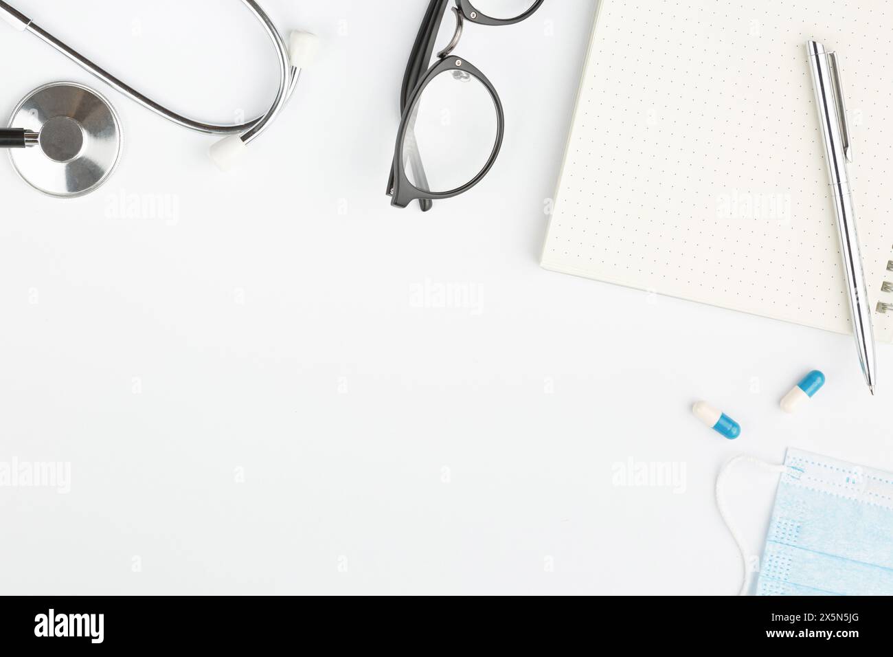 Doctor desk with stethoscope and stationery Stock Photo - Alamy