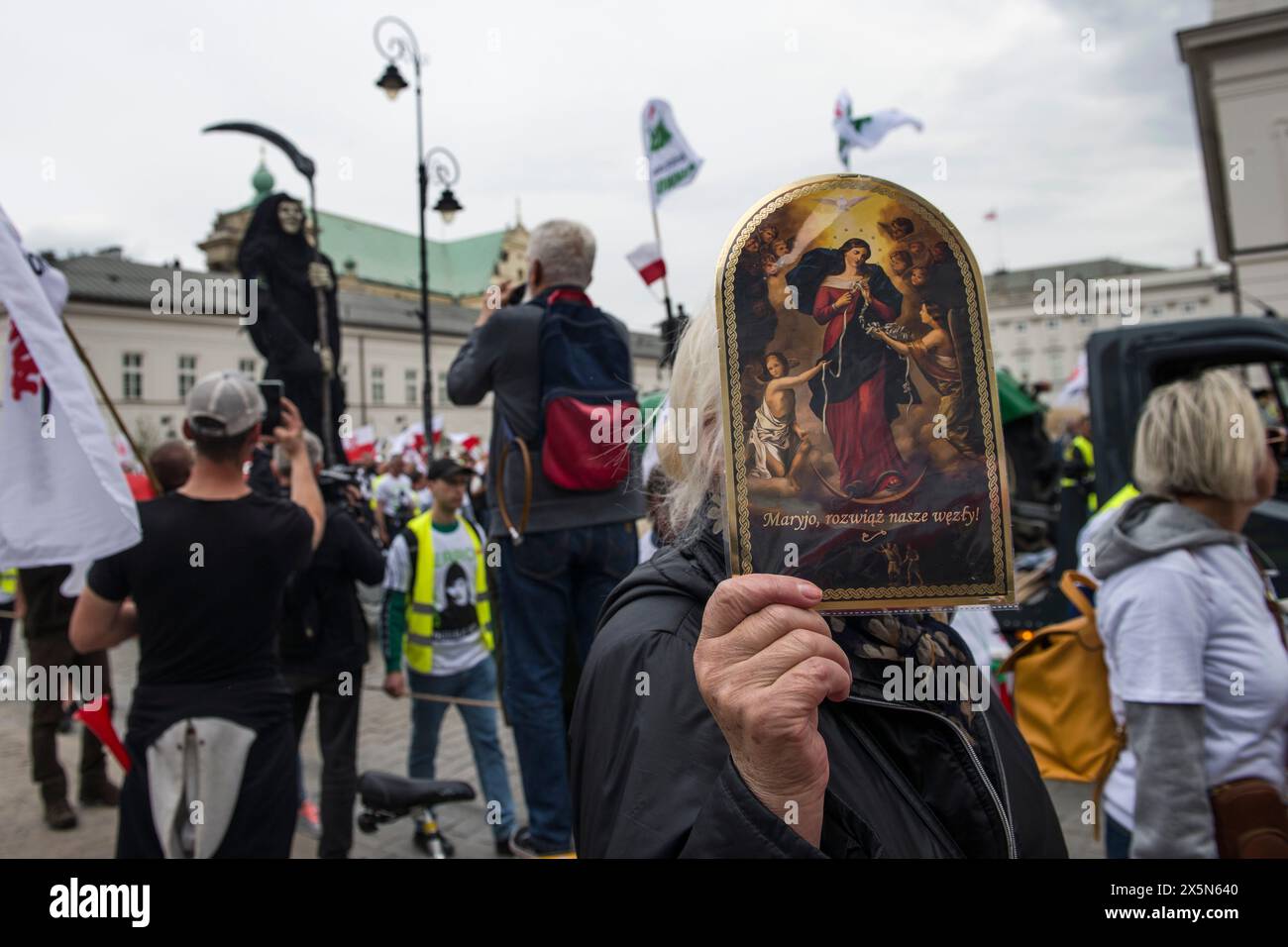 A protester hold a placards with the image of Virgin Mary during the ...
