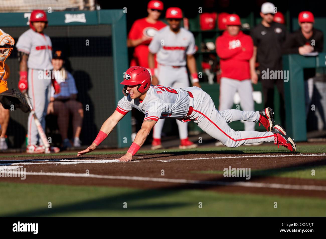 Georgia Bulldogs designated hitter Dylan Goldstein (25) scores against ...