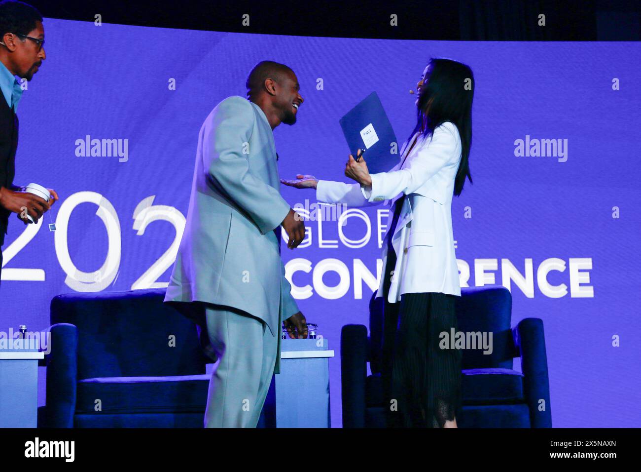 Beverly Hills, CA C May 8th, 2024 C Larry Jackson on left, Usher puts ...
