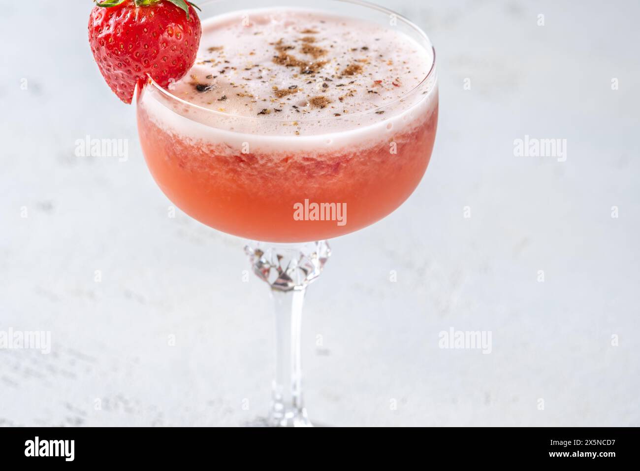 Strawberry fields cocktail garnished with balsamic vinegar drops Stock ...