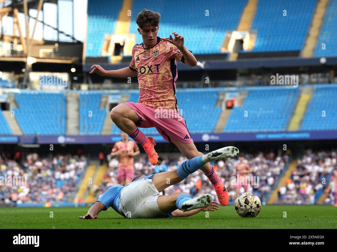 Manchester City's Matty Henderson-Hall (left) and Leeds United's Josh ...