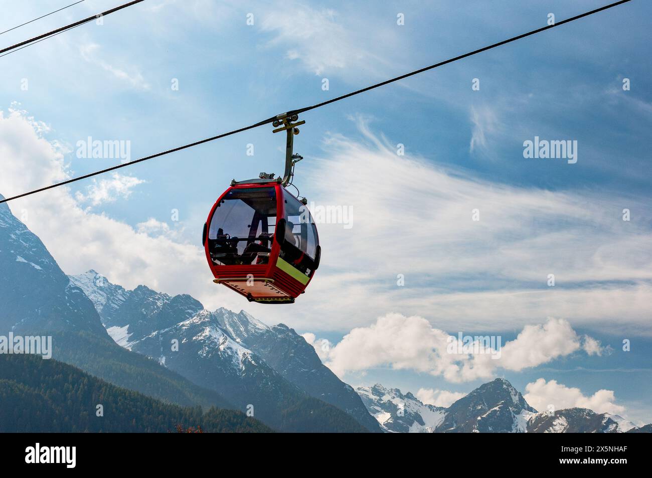 Red cable car in the Alps Stock Photo - Alamy