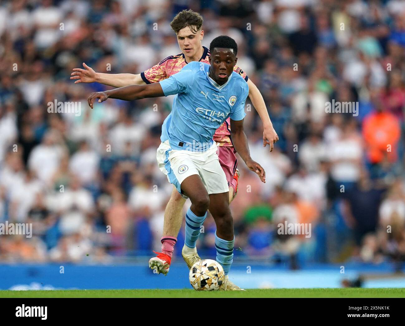 Leeds United's Rhys Chadwick-Chaplin and Manchester City's Justin ...