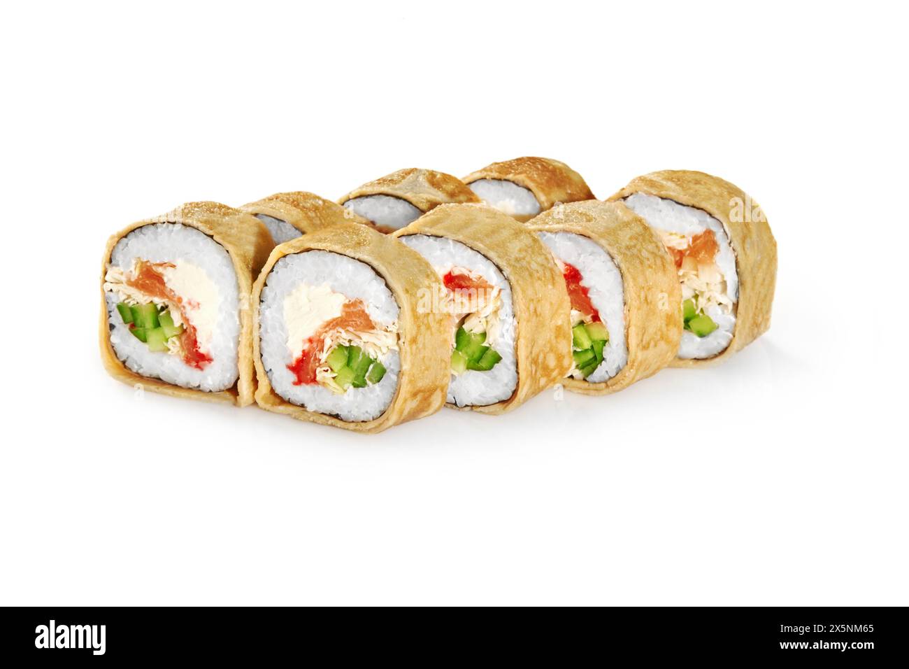 Appetizing sushi rolls in crepe filled with salmon, tobiko, cream ...