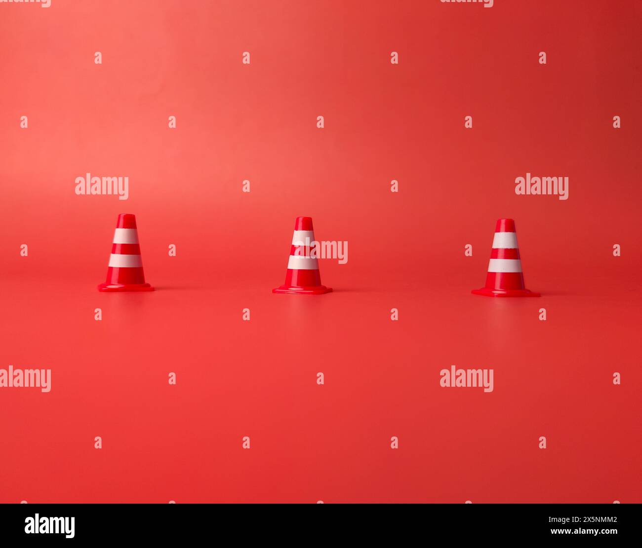 Mini Plastic traffic Cones Roadblock Mini Traffic Signs on a red ...