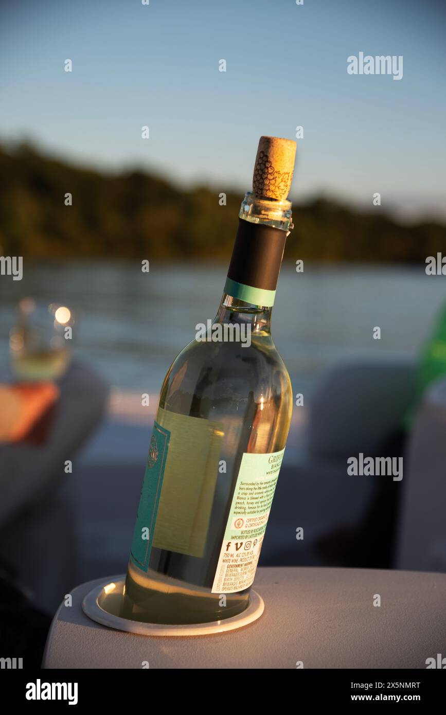 An evening happy hour cruise. A wine bottle on a boat on a Minnesota ...