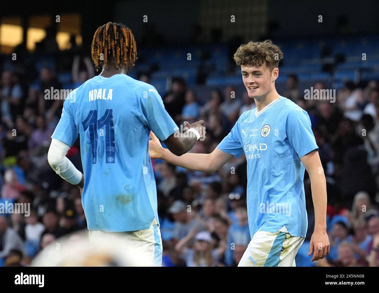 Manchester City's Matty Warhurst (right) celebrates scoring their side ...