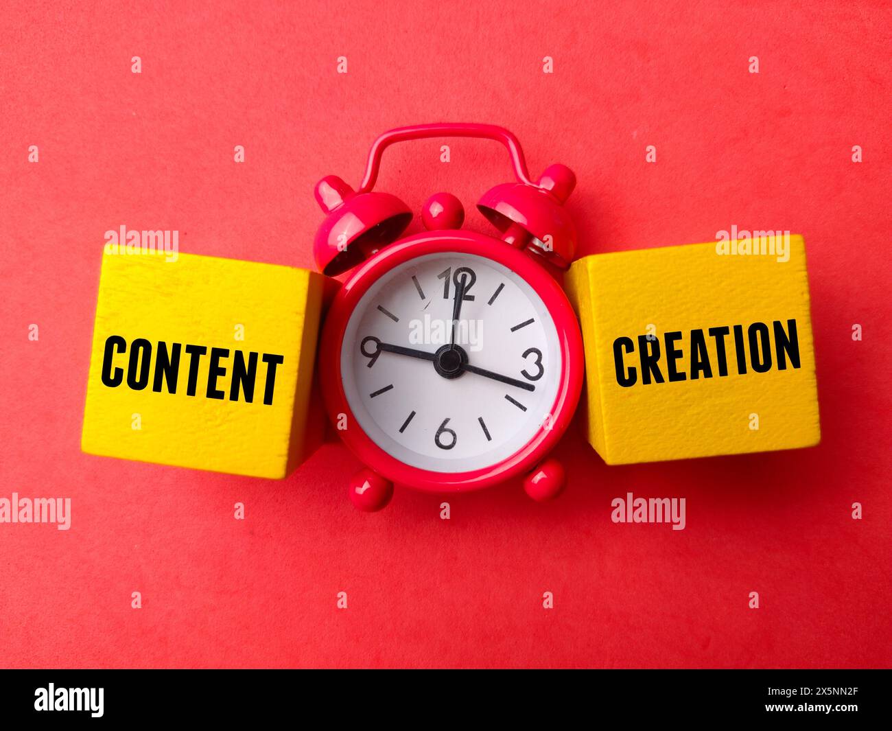 Top view clock with text CONTENT CREATION on red background Stock Photo ...