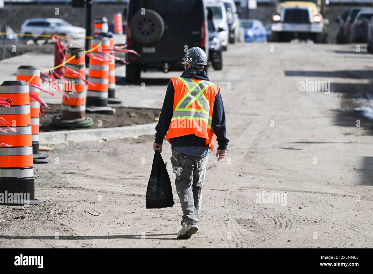 A construction worker onsite of a condo building under construction ...