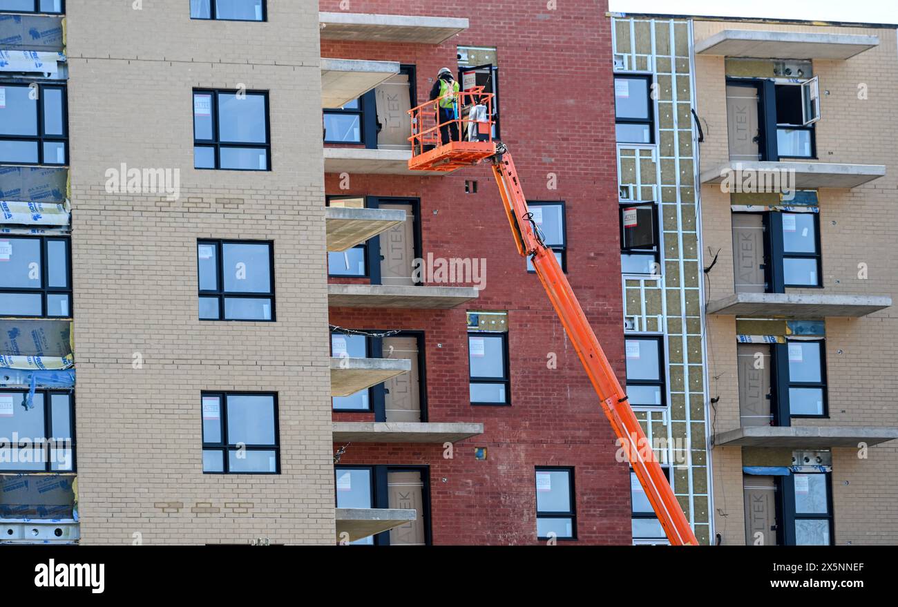 A construction worker onsite of a condo building under construction ...