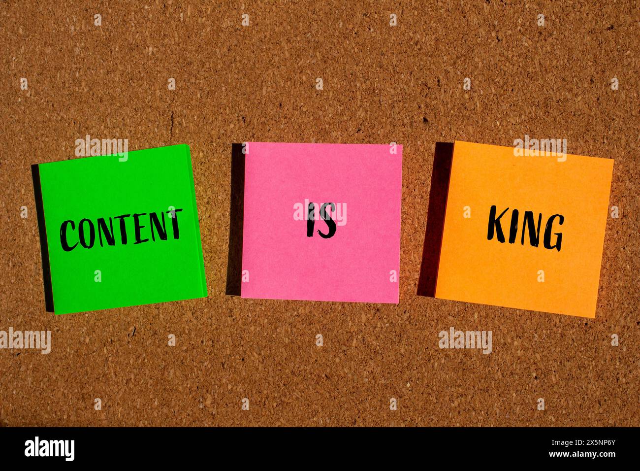 Content is king words written on colorful paper stickers with brown ...