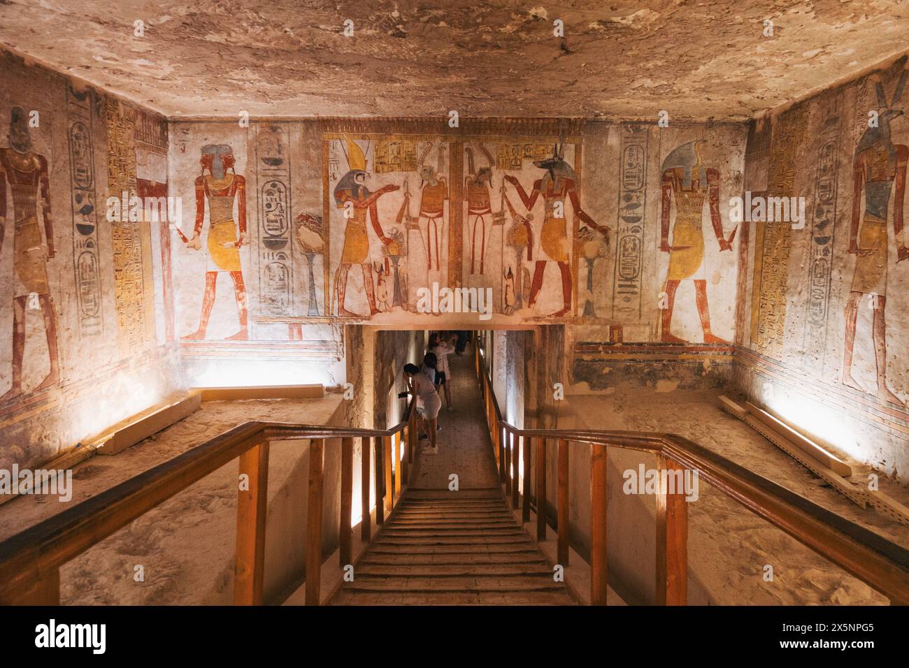 A view of the painted walls and entrance to a tomb in the Valley of the ...