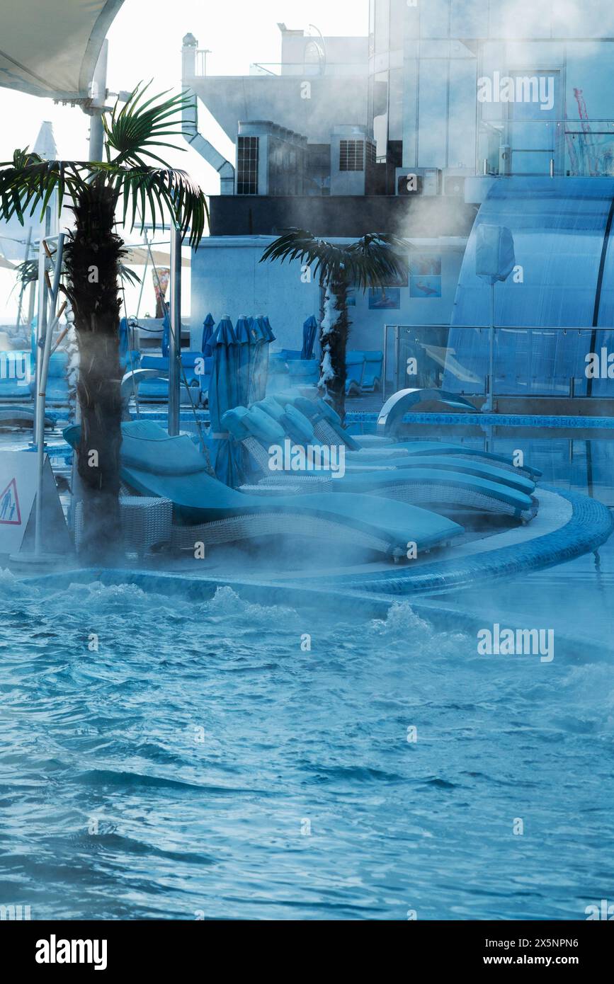 Hot spring, pool with hot mineral water. Steam over the outdoor pool in ...