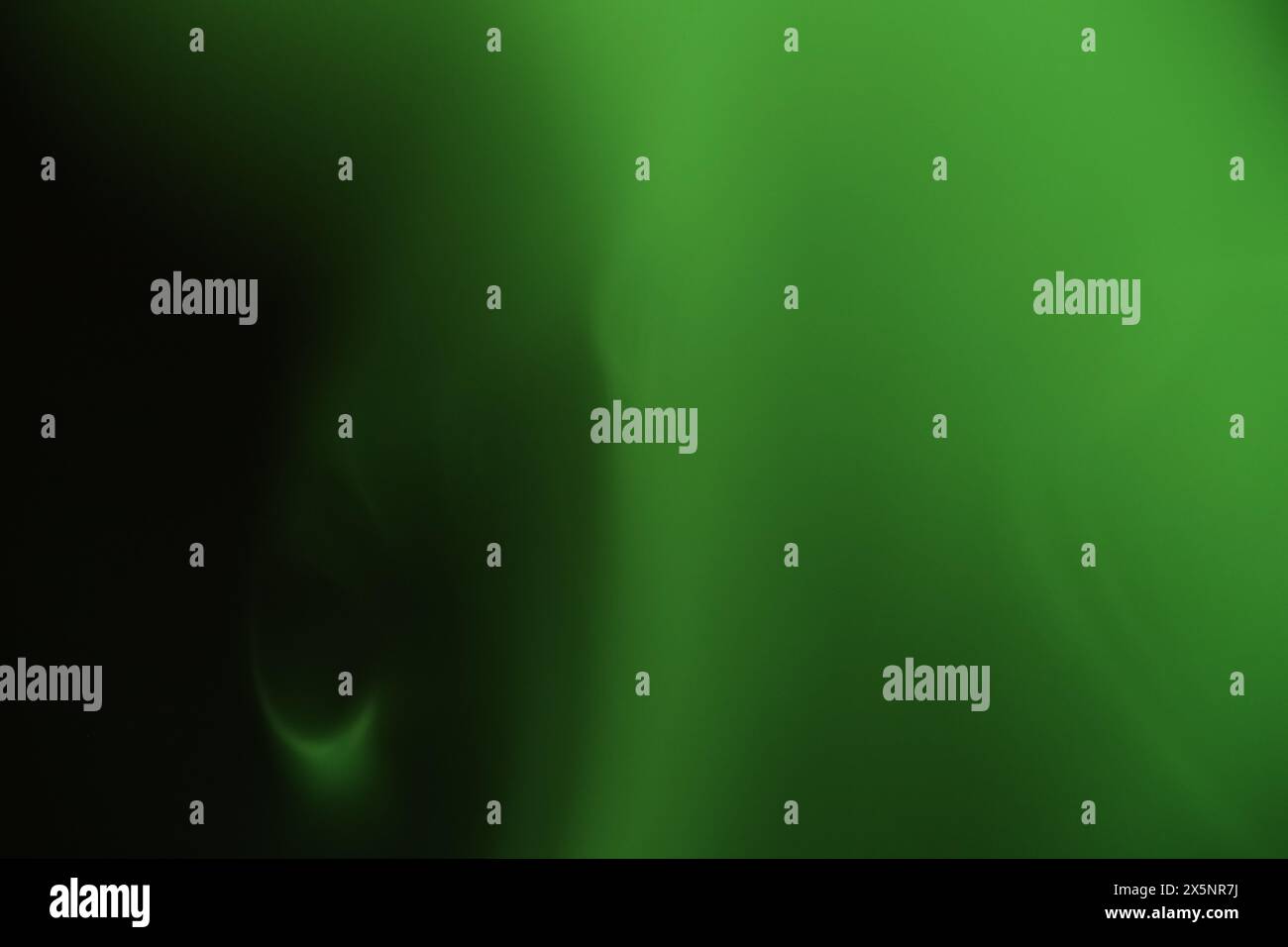 Green smoke on a dark background, colourful abstract, green fog ...