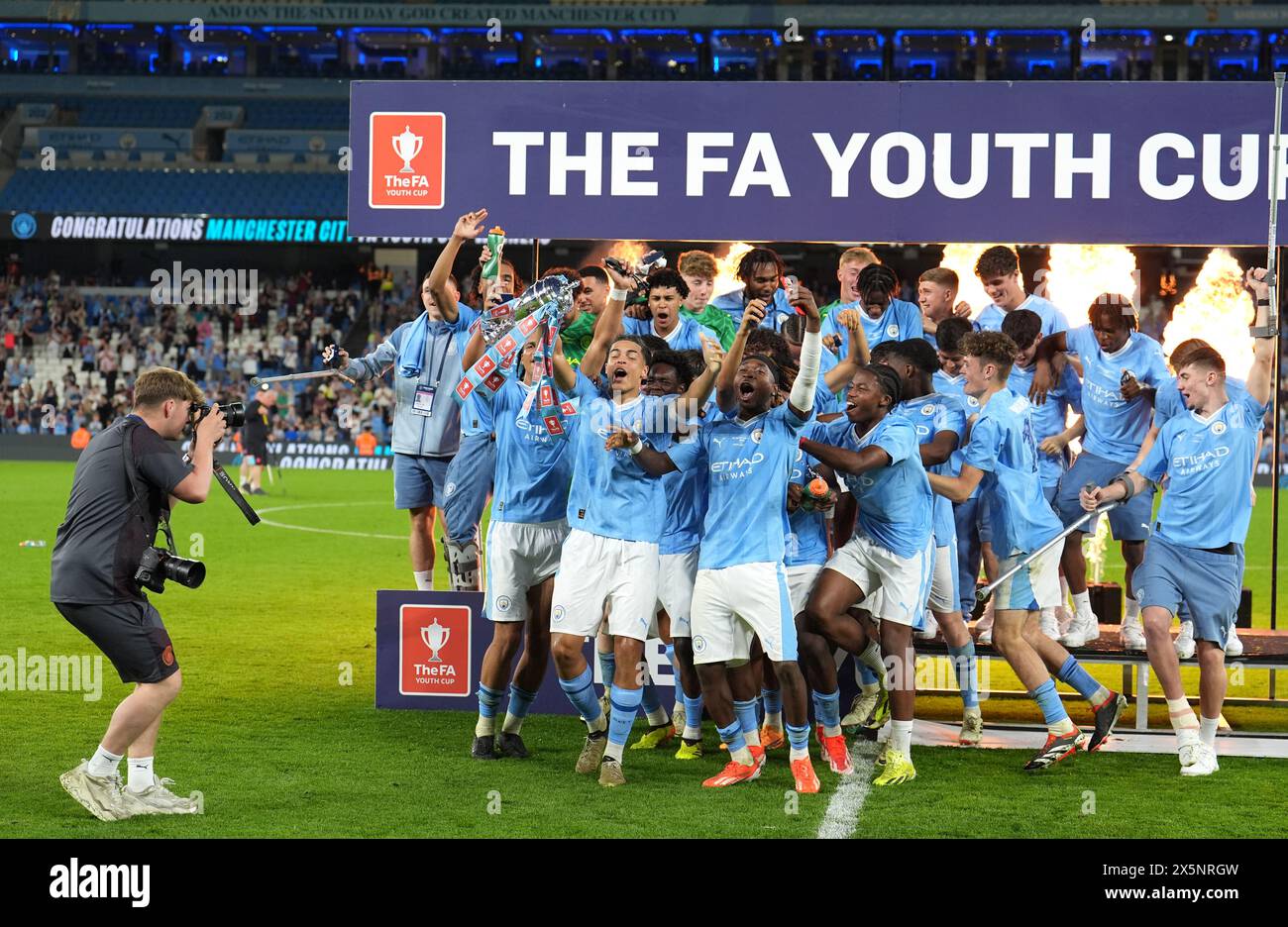Manchester City players celebrate with the trophy following during the ...