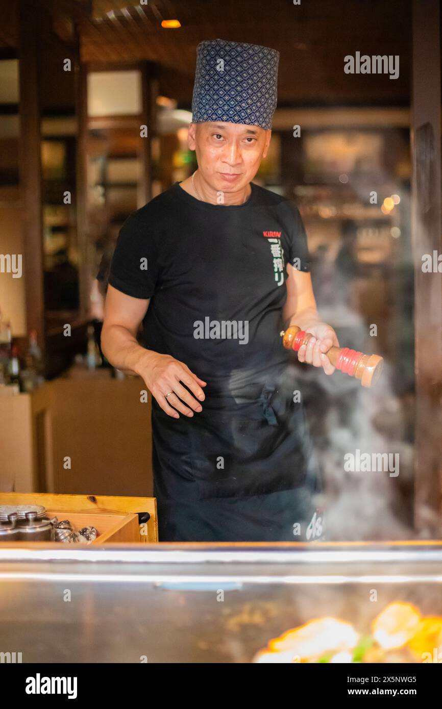 Berlin, Germany 08. 16. 2023. Teppanyaki chef cooking at teppan in a ...