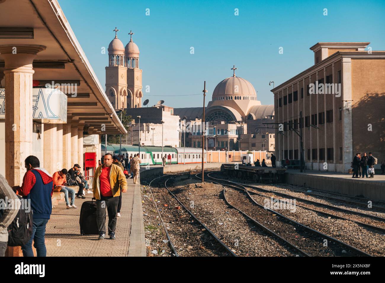 Passengers wait on the train platform at Luxor Railways Station in ...