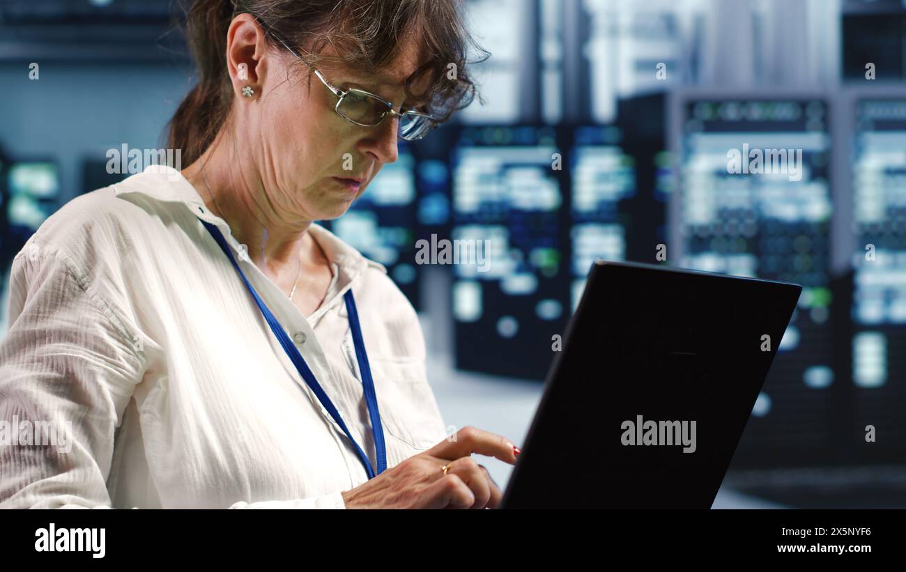Meticulous specialist working in data center housing GPU dedicated ...