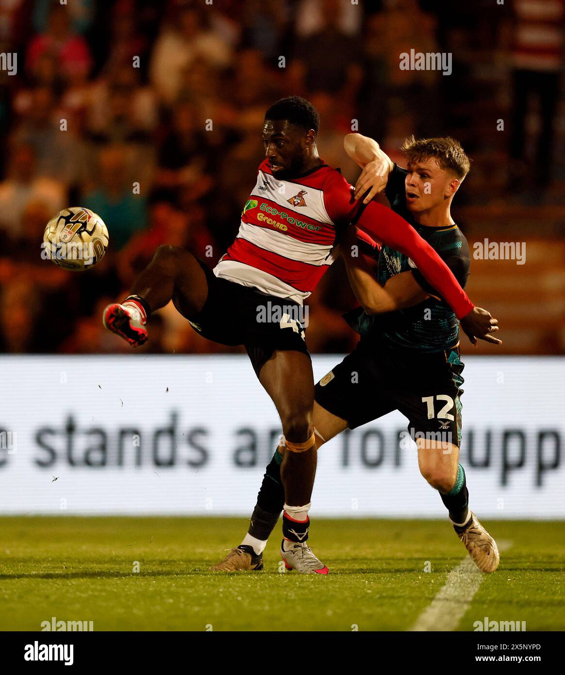 Doncaster Rovers' Hakeeb Adelakun and Crewe Alexandra's Ed Turns (right ...