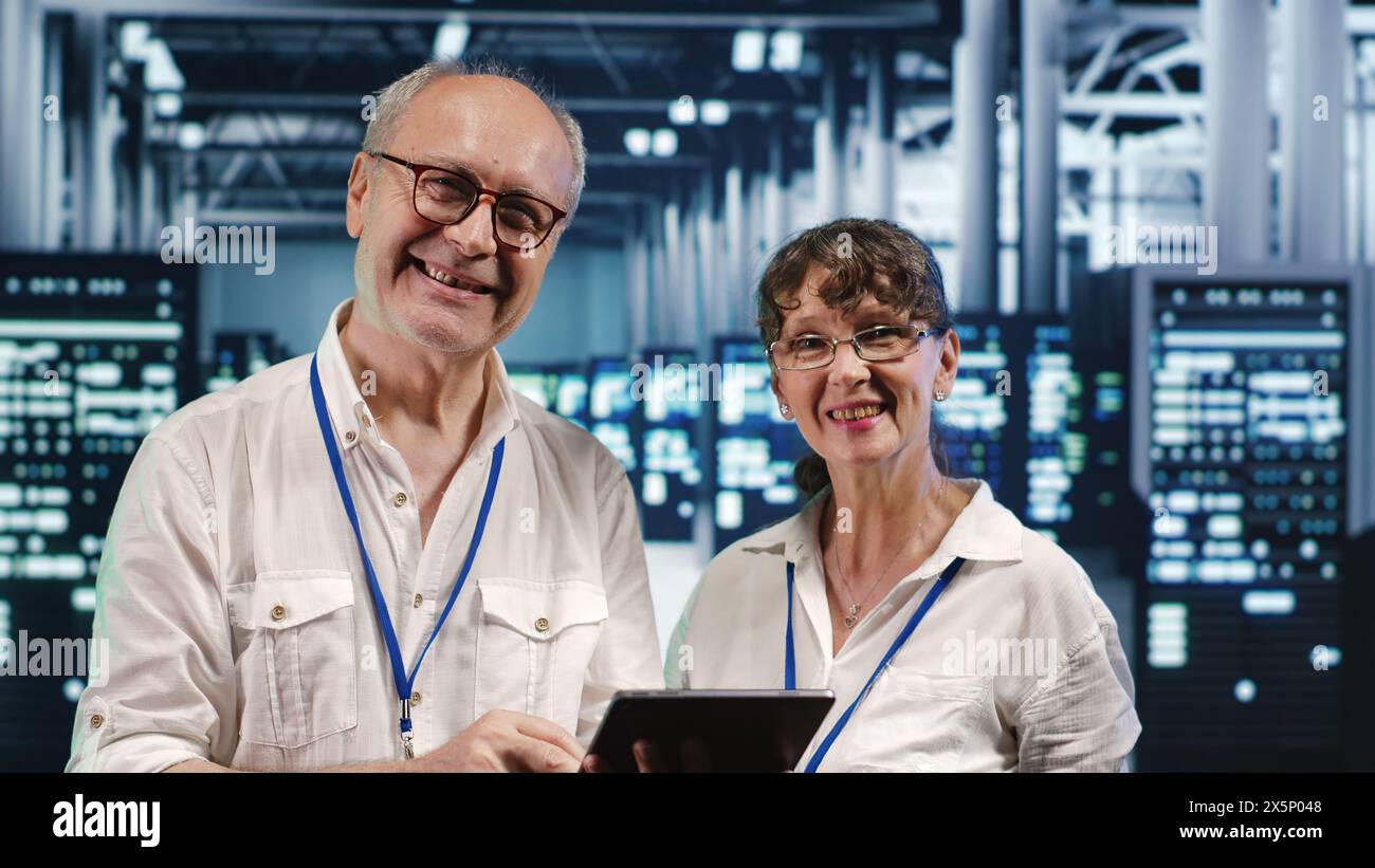 Colleagues In Data Center Using Laptop To Monitor Energy Efficient Rigs Server Farm Using