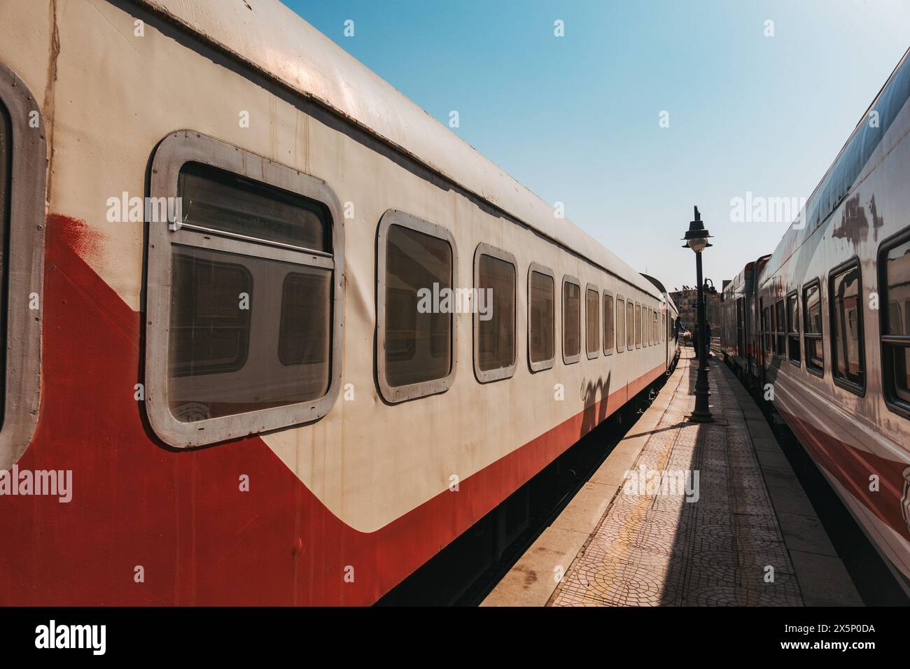 On the platform between two Egyptian Railways carriages in Aswan, a ...