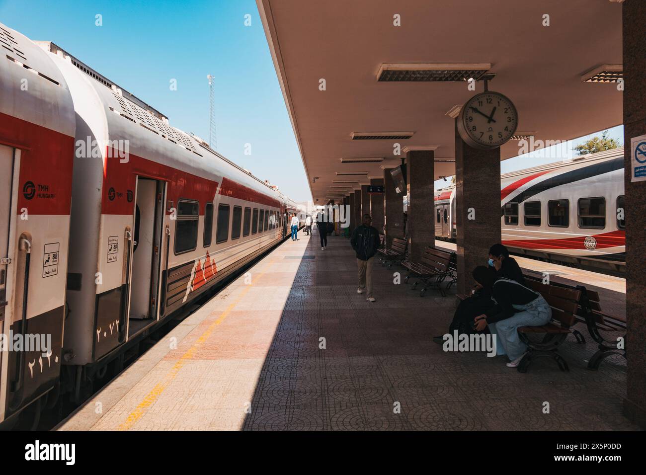 On the platform between two Egyptian Railways carriages in Aswan, a ...
