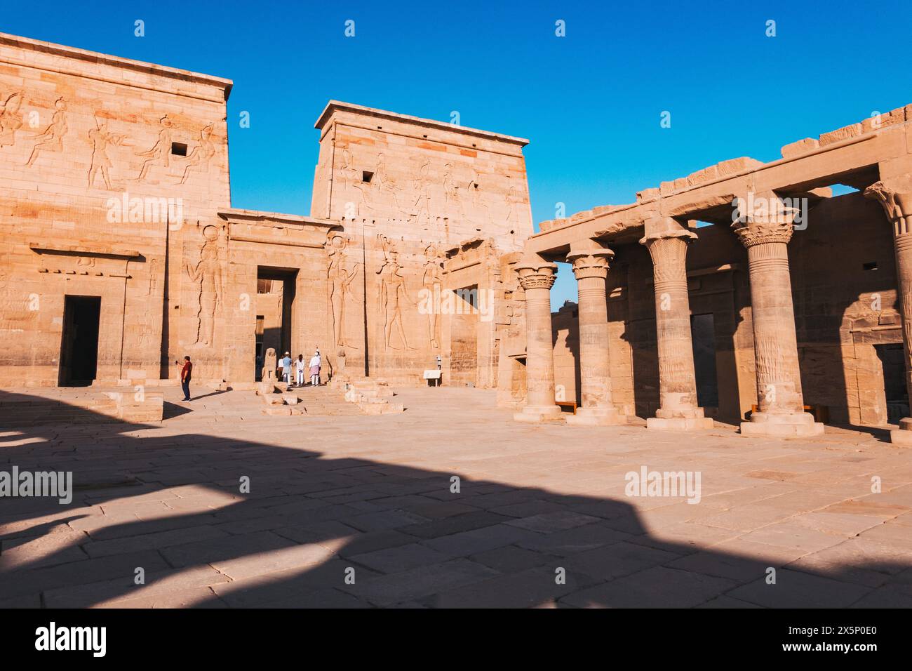 Tourists enter the main temple on the island of Philae, Aswan, Egypt ...