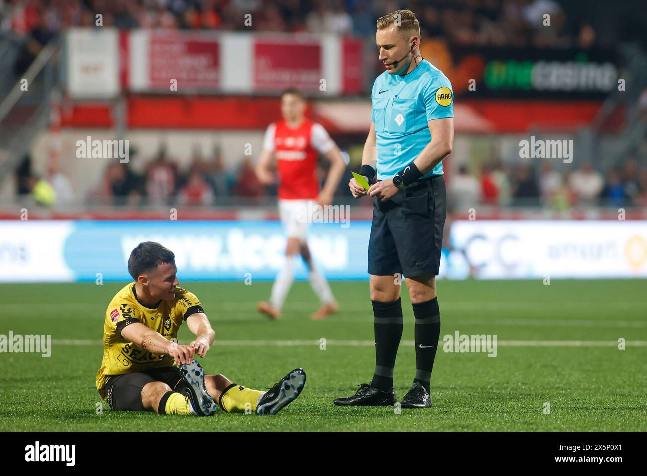 MAASTRICHT,NETHERLANDS - MAY 10 : Referee Martijn Vos shows the yellow ...