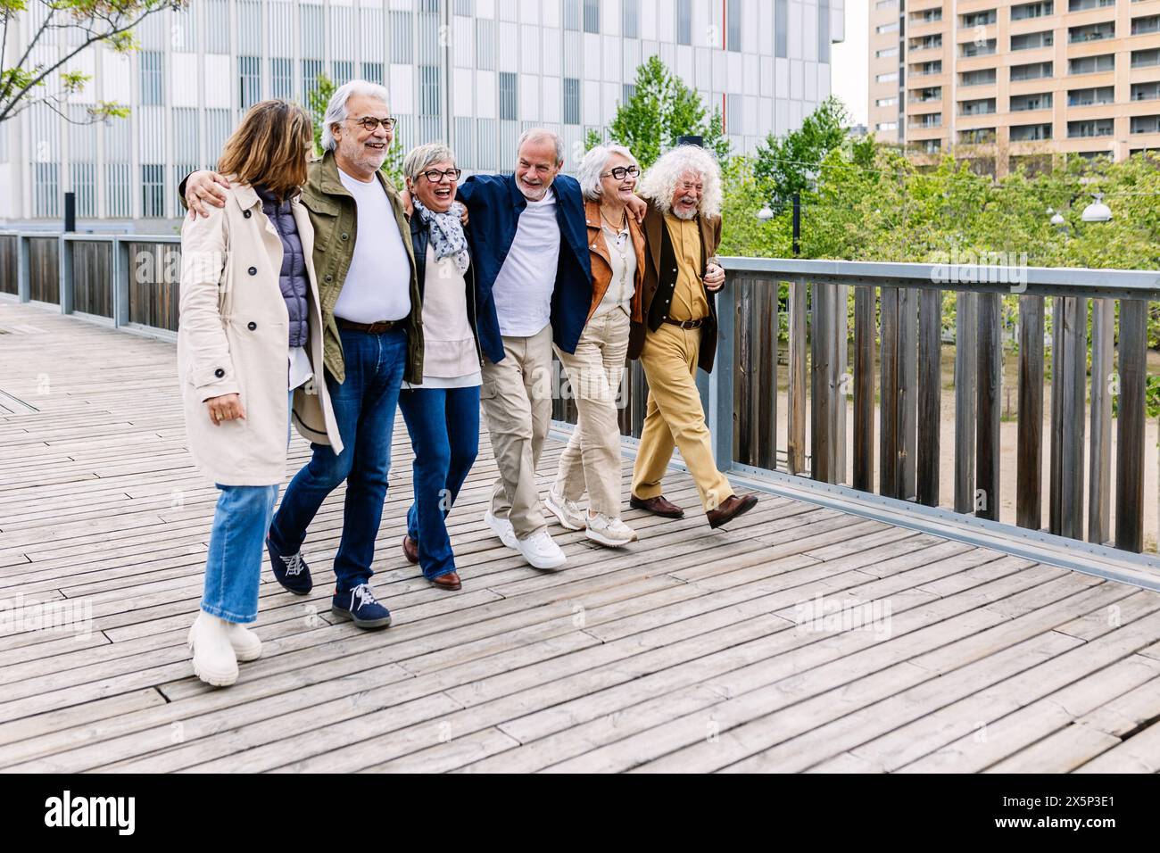 Senior group of retiree people having fun enjoying a walk at city ...