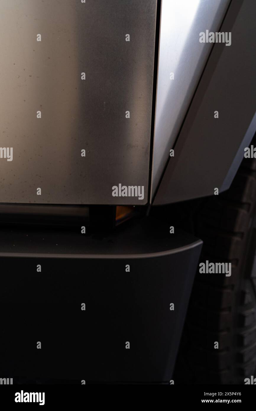 Close-Up View of the Tesla Cybertruck Side Panel and Tire Stock Photo ...