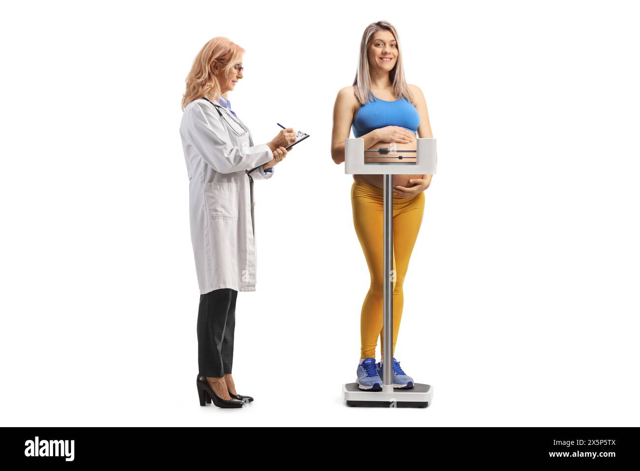 Doctor checking weight of a pregnant woman isolated on white background ...