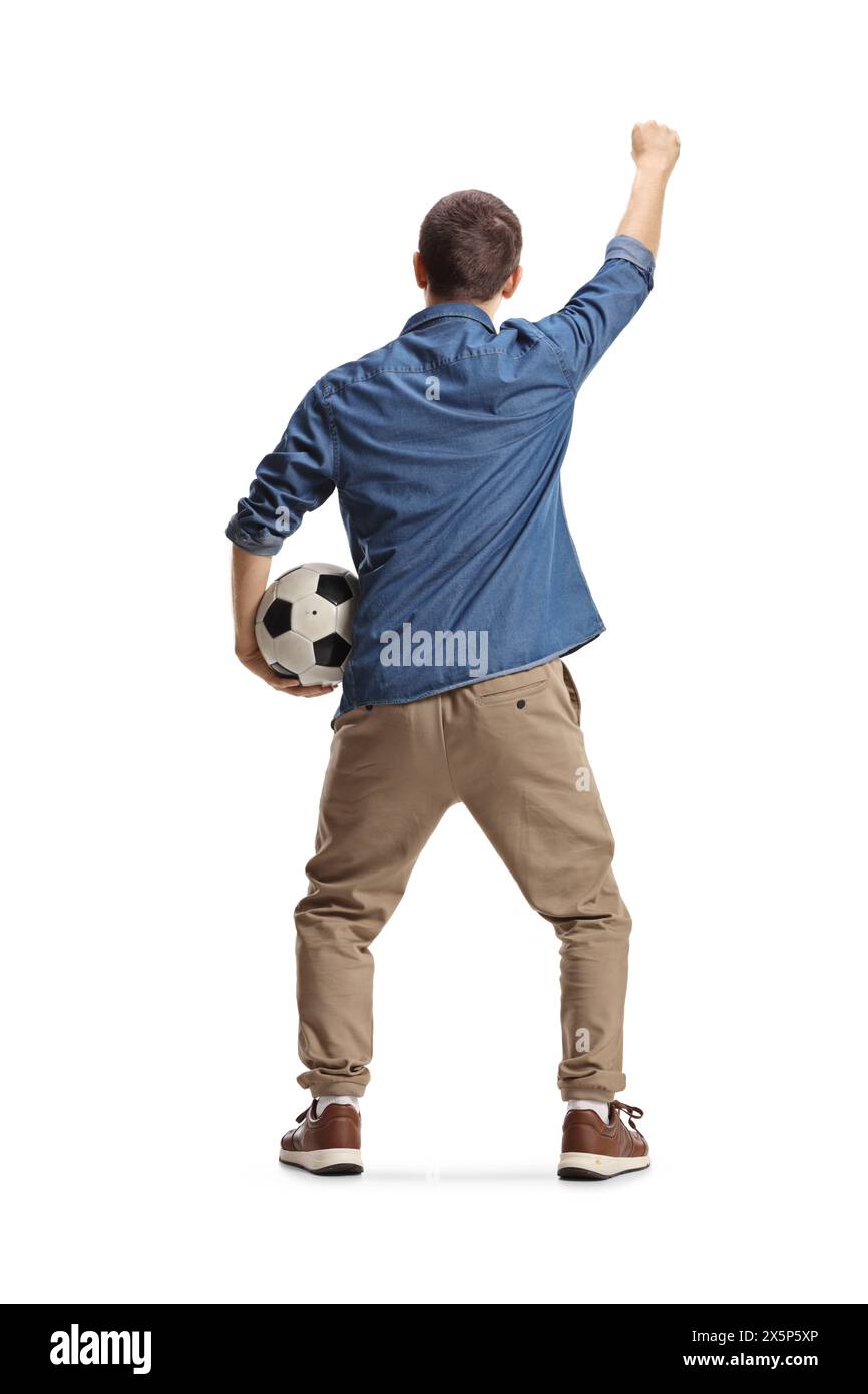 Rear view of a man cheering with a football isolated on white ...