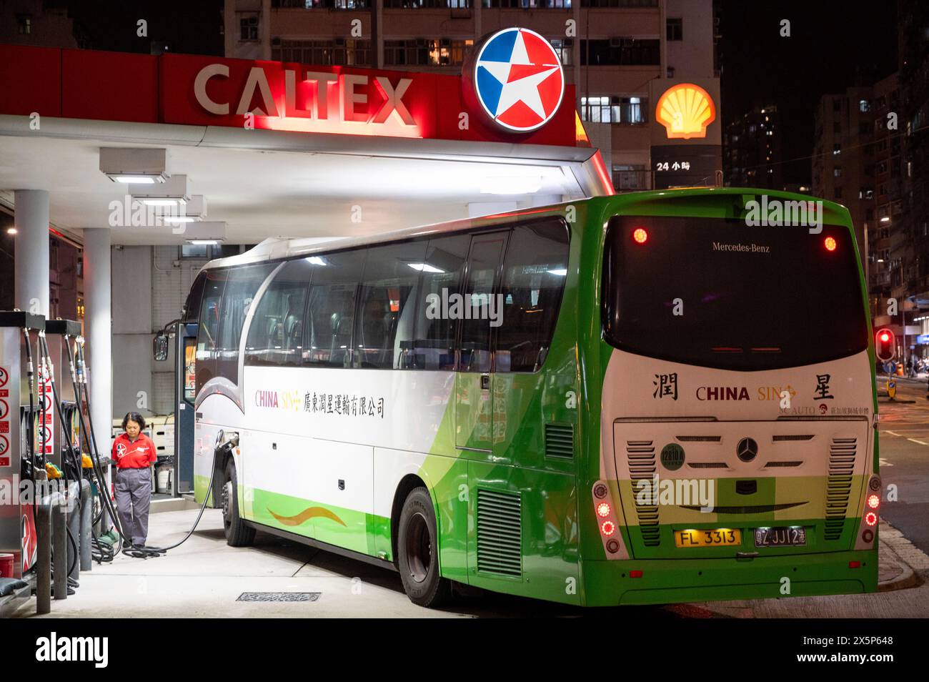 A bus refuels oil at a gas station from the Asian-Pacific gas and oil ...