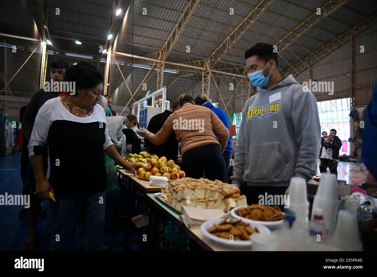 Canoas, Brazil. 10th May, 2024. Photo, Volunteers serving coffee and ...