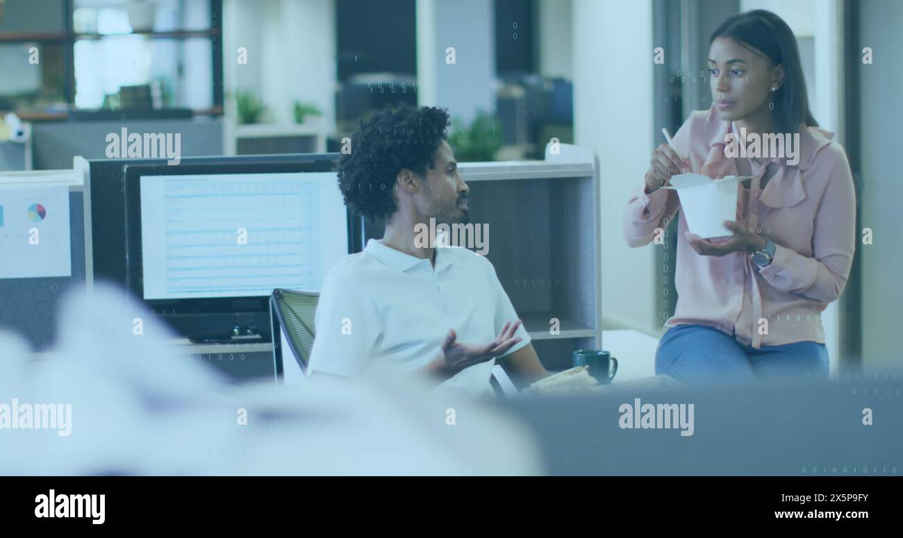 A biracial male team leader and biracial female team member are ...