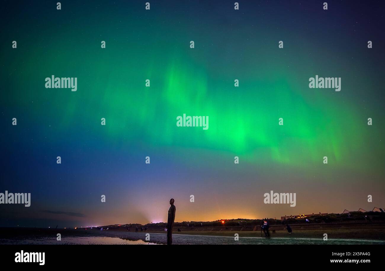 The aurora borealis, also known as the northern lights, glow on the ...
