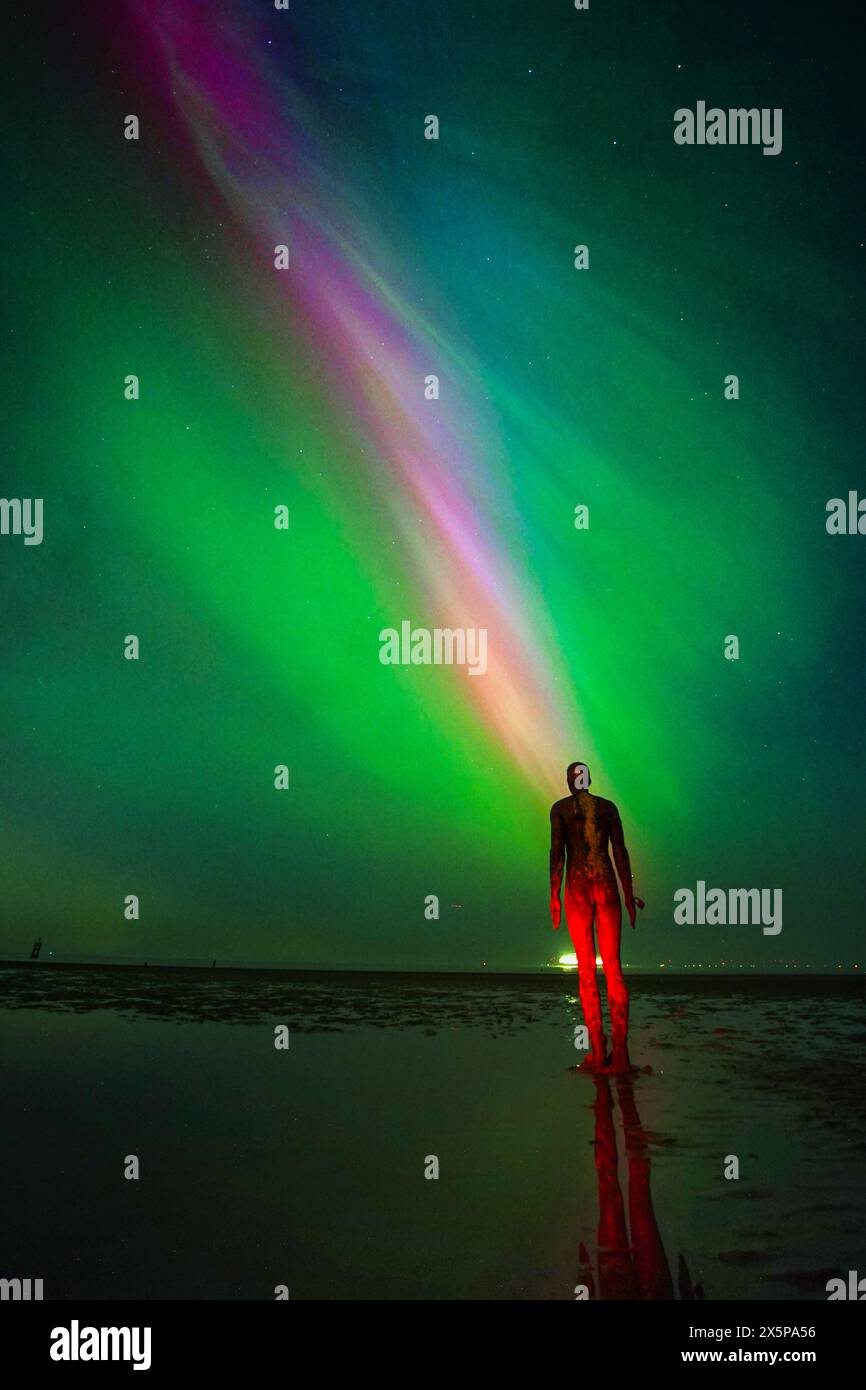 The aurora borealis, also known as the northern lights, glow on the ...