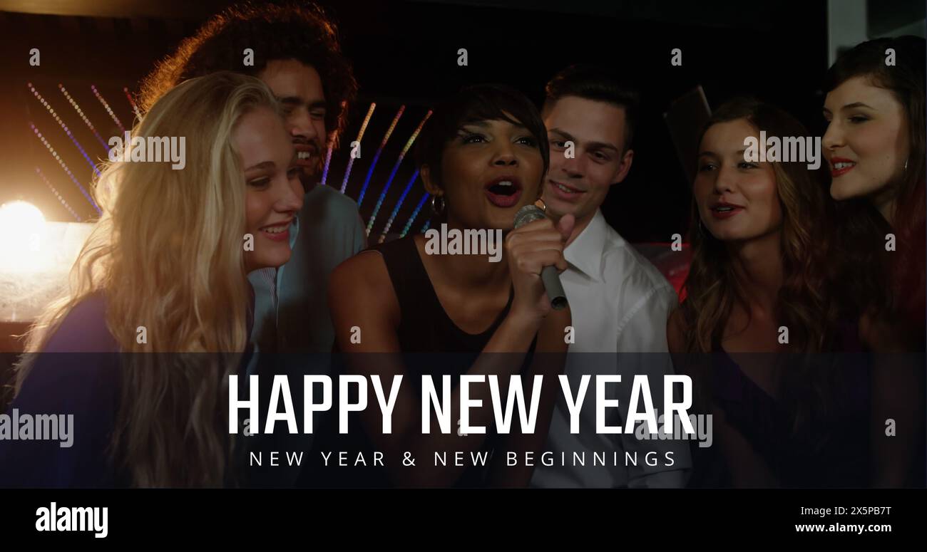 Friends celebrating New Year's Eve, singing with microphone Stock Photo ...