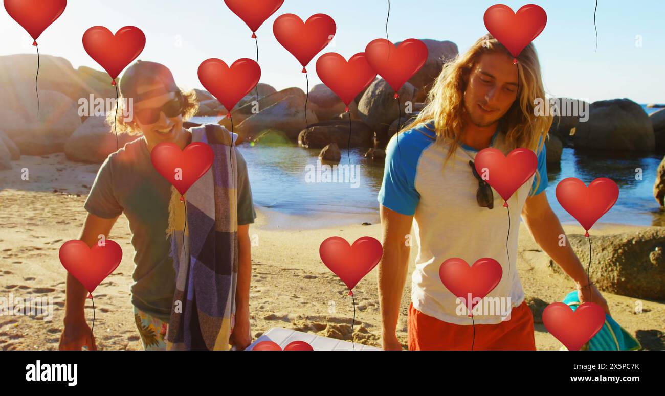 Image of heart shaped balloons moving up over caucasian male friends ...