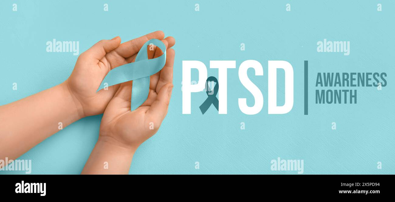 Hands holding ribbon on blue background. Post-Traumatic Stress Disorder ...
