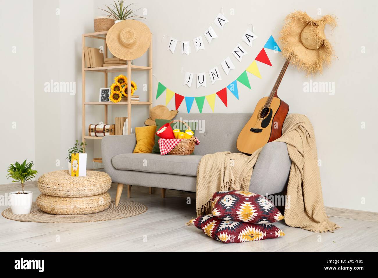 Interior of festive living room with grey sofa and decorations for ...